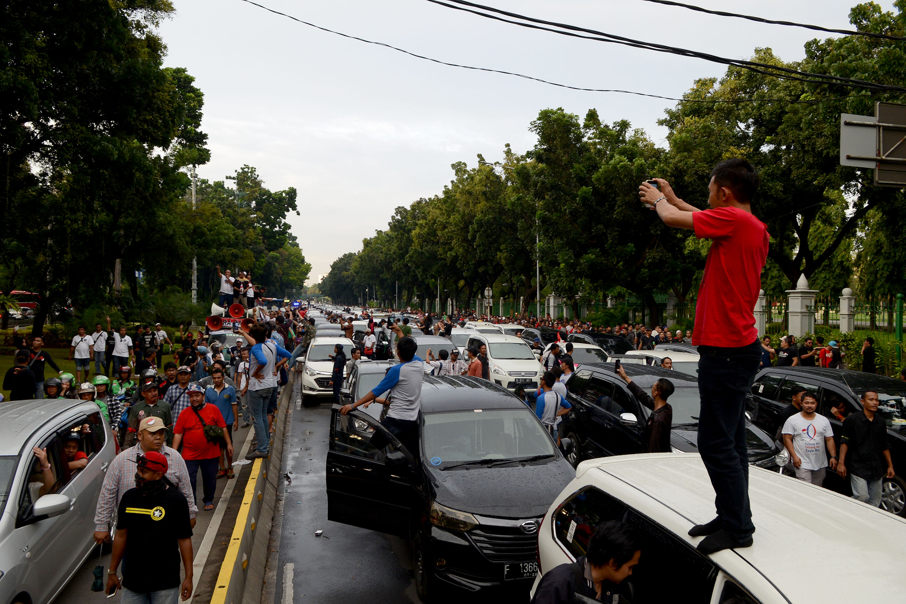 KPPU Seret Grab dan TPI ke Meja Hijau, Terancam Denda Rp25 Miliar